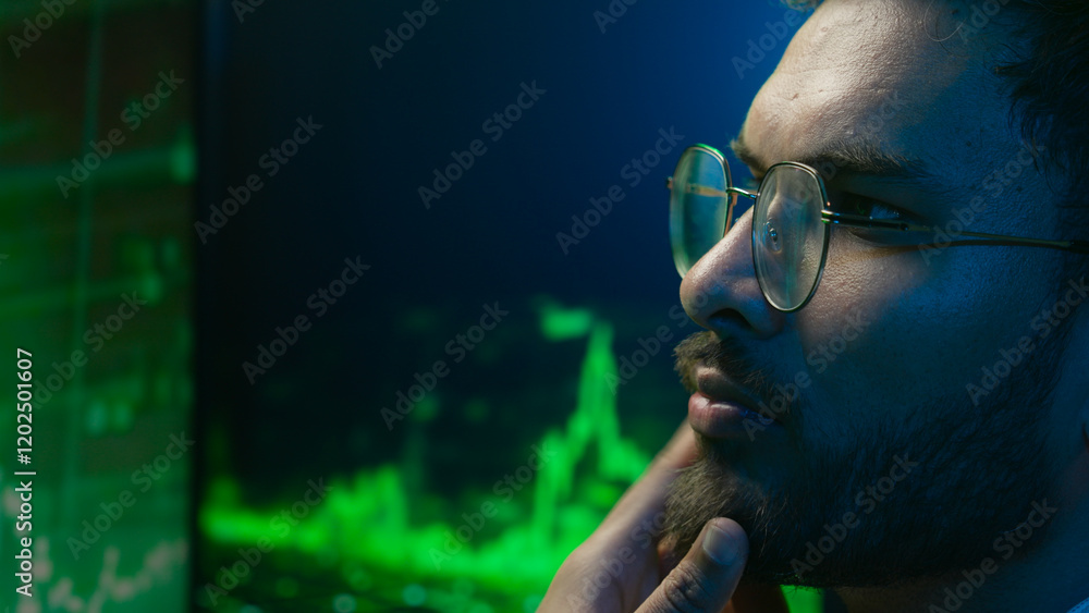 Indian Arabian man programmer hacker thinking looking computer chart guy trader analysis trading ...
