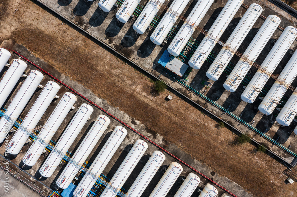 Aerial view of a large LPG gas storage facility with rows of white ...