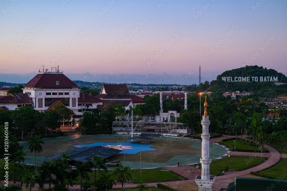 Batam skyline with "Welcome to Batam" text. Cityscape from a window ...