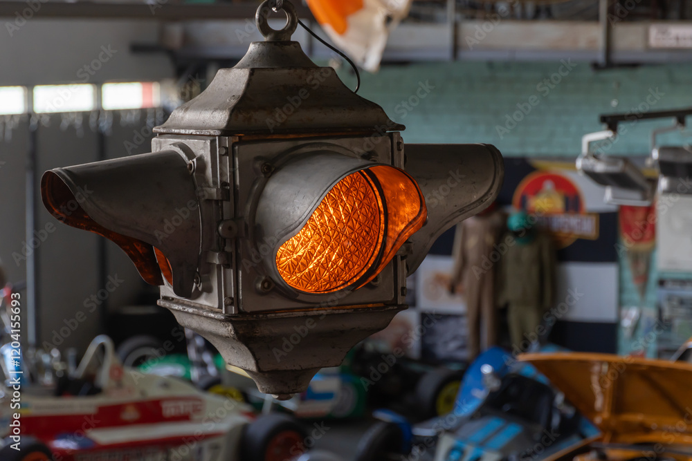 Vertical vintage traffic light close-up. Metallic old-fashioned ...