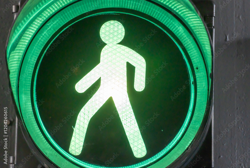 Green light of vintage traffic light close-up. Metallic old-fashioned ...