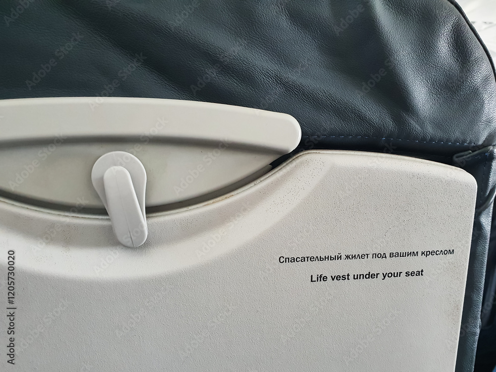Live vest under your seat. Safety instruction for passengers on an ...