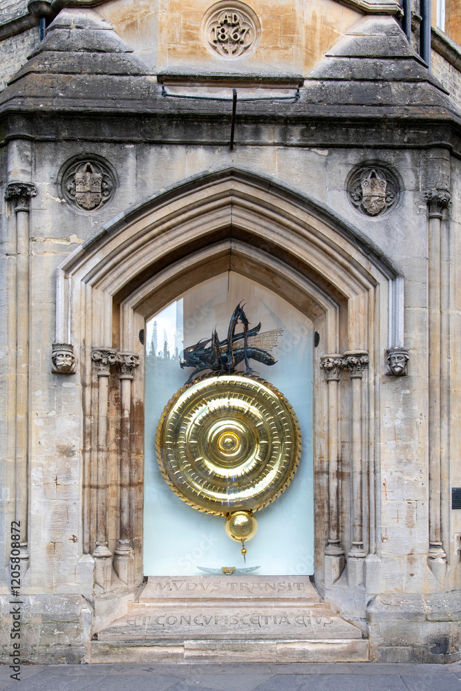 Cambridge, UK-24 June 2024; The sculptural Corpus Clock or Grasshopper ...