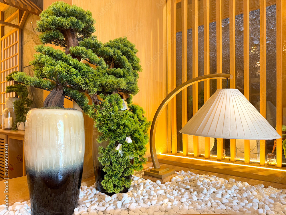 Close up series of bonsai vase with curved table lamp, placed on a ...