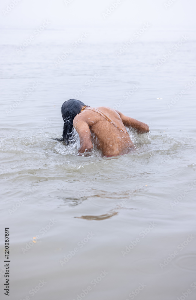 Mahakumbh, Portrait of holy male sadhu baba standing in holy river ...