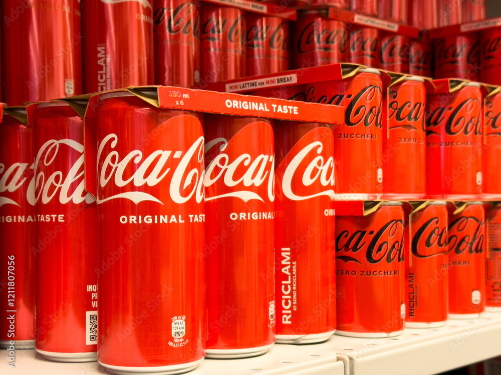 Coca-cola cans on store shelf display with original and zero sugar ...