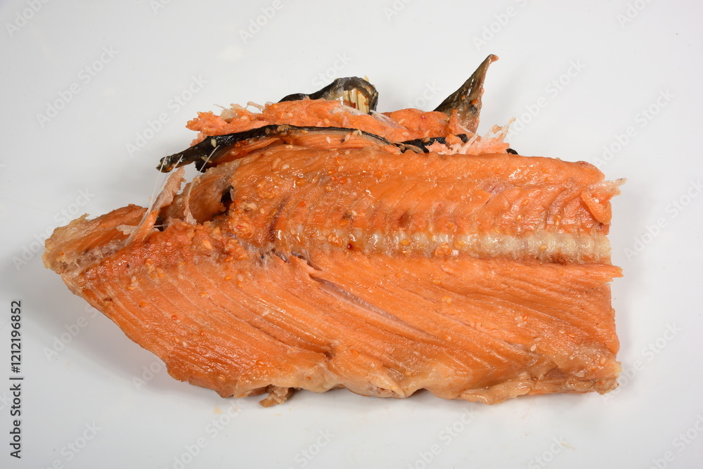 Hot smoked salmon trim and leftovers with bones and fins isolated on ...