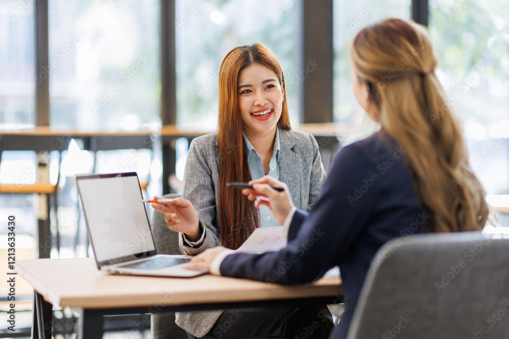 Aisan woman colleagues share their experience working in the office at ...