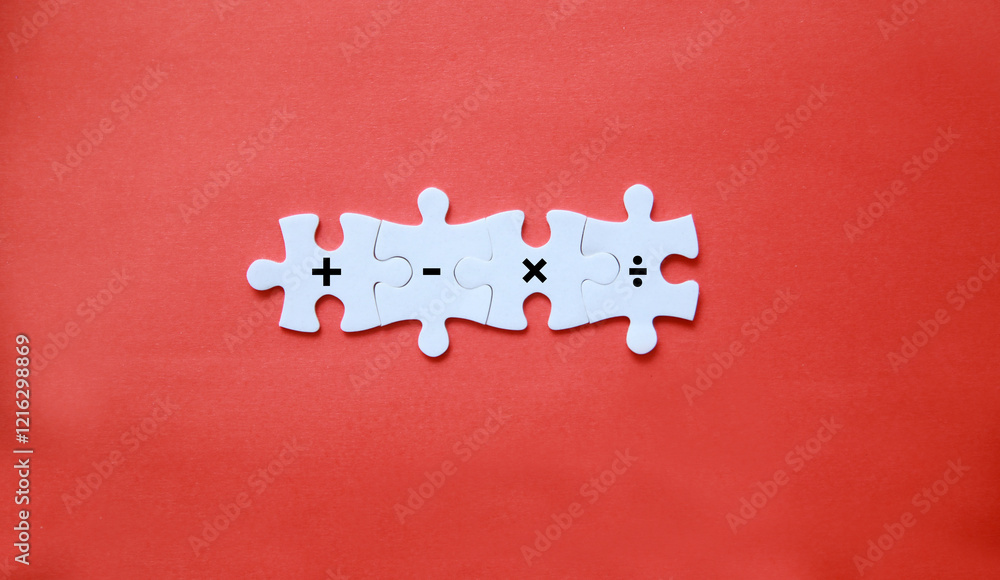 jigsaw puzzle with plus, minus, multiplication and division symbols ...
