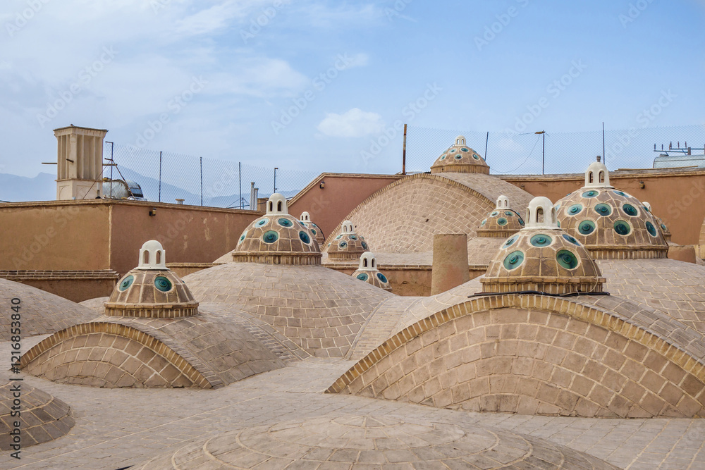 Traditional Persian roofs with domes and turrets for ventilation and air circulation inside the ...