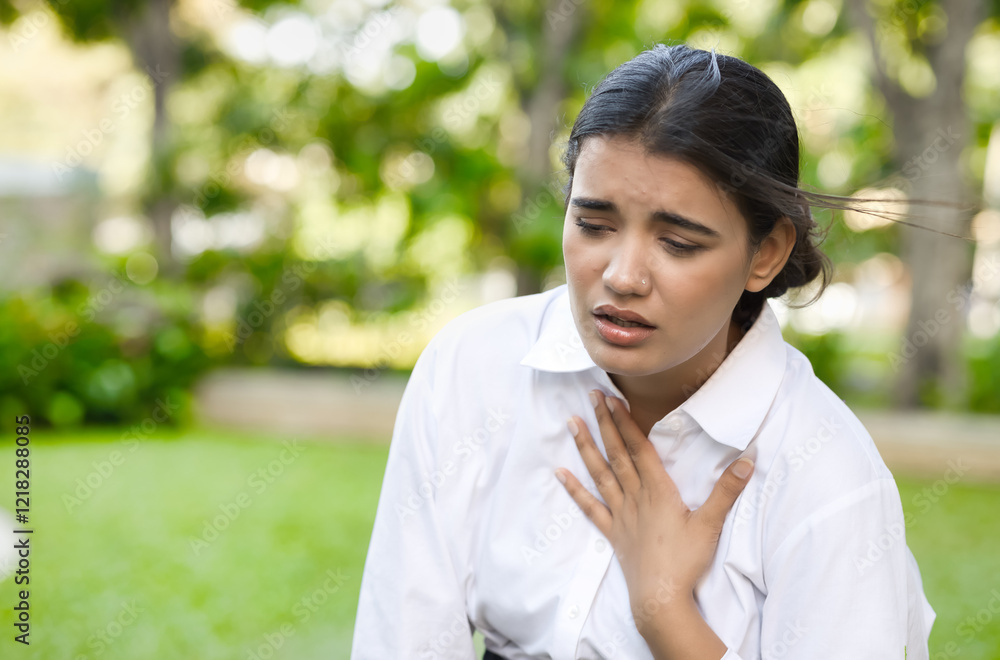 Unwell, ill and sick South Asian Indian woman panting, suffering with ...