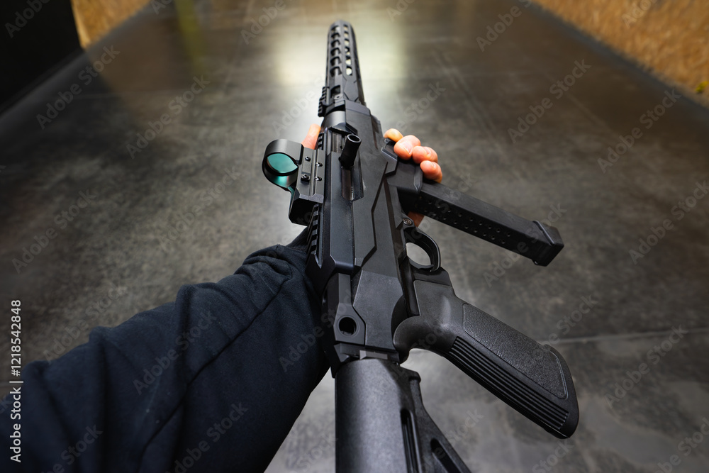 Tactical pcc rifle for 9mm pistol caliber with red dot sight in mans ...