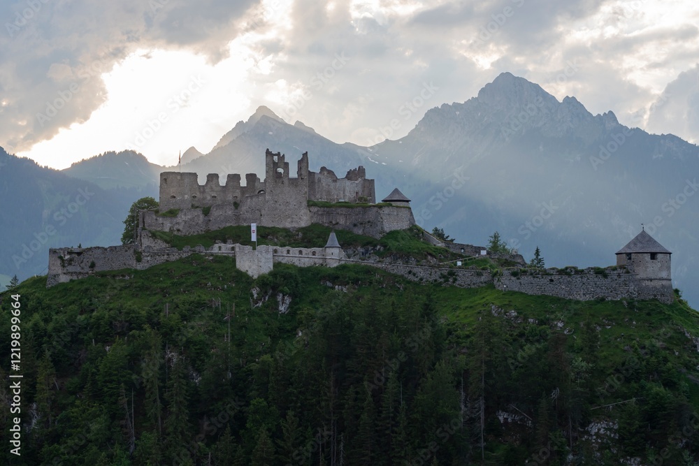 View of an old dilapidated medieval castle on top of a mountain in the ...