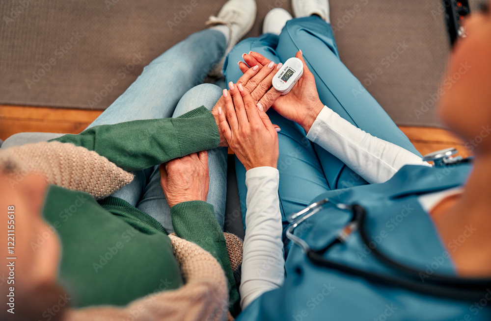Top view of a nurse measuring the saturation of an elderly patient ...