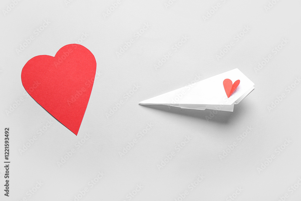 Paper plane and red heart on grey background. Valentine's Day ...