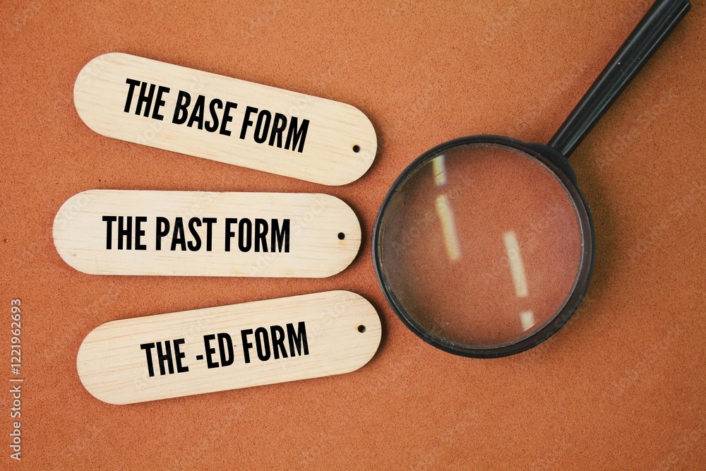 magnifying glass and stick with the words the base form, the past form ...