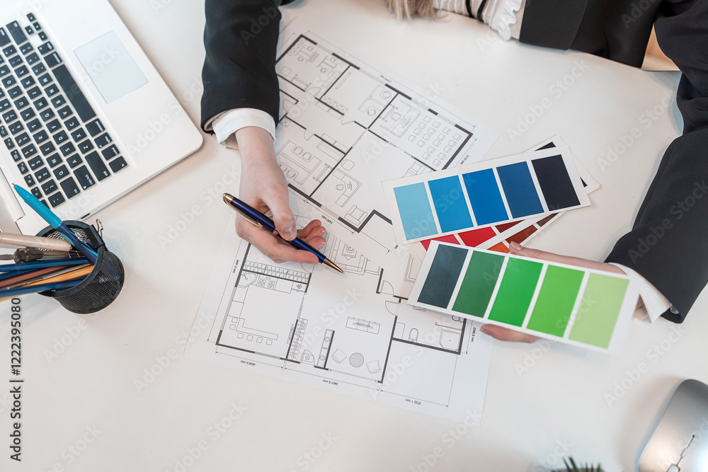 hand of architect chooses color for interior, house plan sketch ...