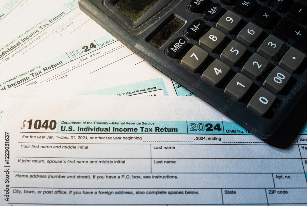 Preparing the US 1040 individual income tax return with a calculator ...