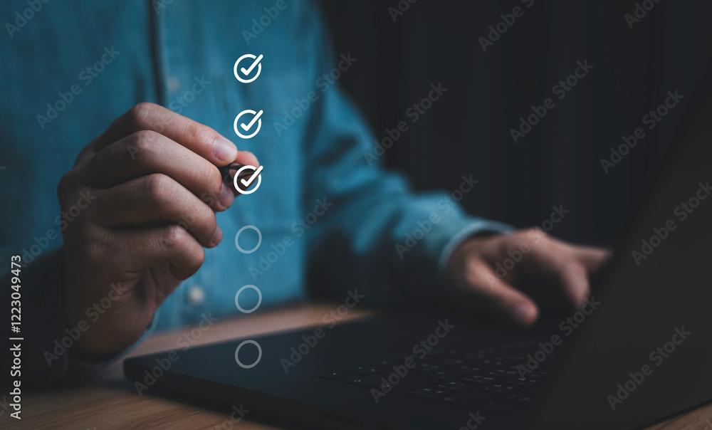 Businessman use pen to tick correct sign mark in checkbox for quality ...