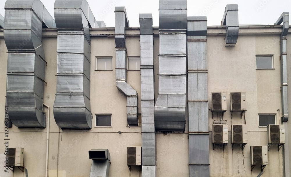 Industrial ventilation ducts and air conditioning units on the exterior ...