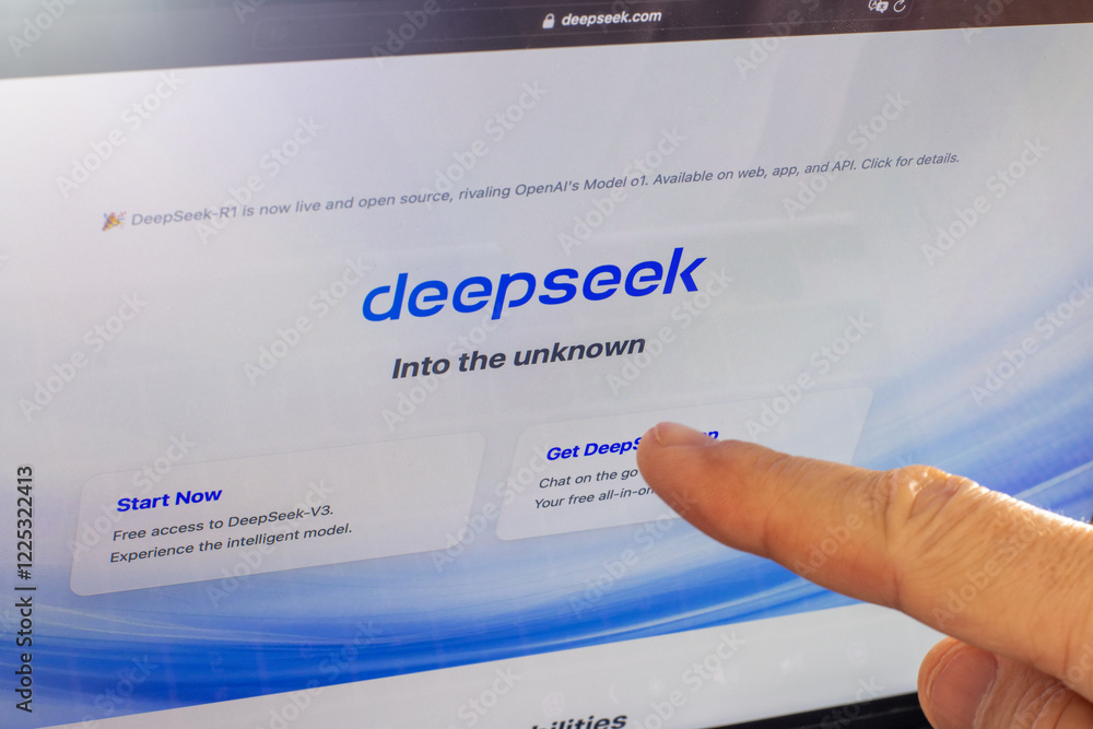 Fingers point to the Deepseek logo displayed on a computer screen ...
