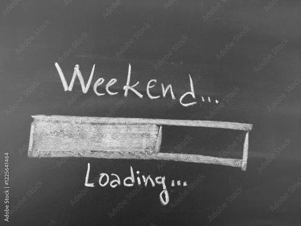 Handwritten chalkboard text of 'weekend loading' with a progress bar ...