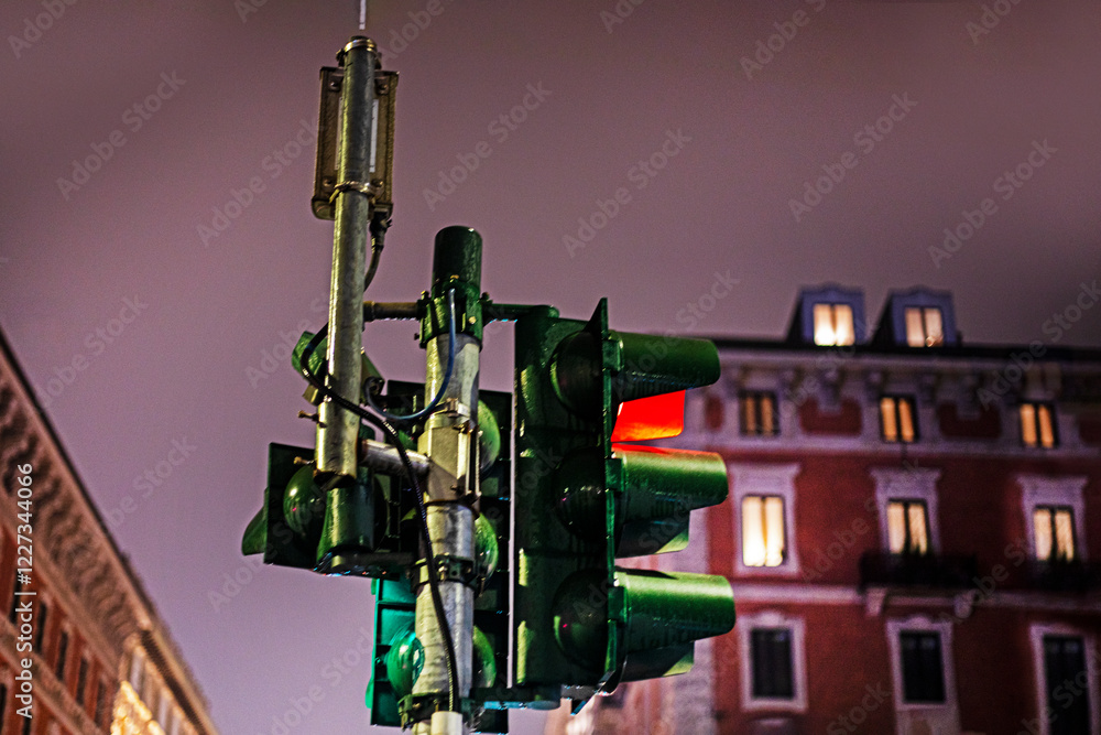triple traffic light at the intersection with red and green lights in ...