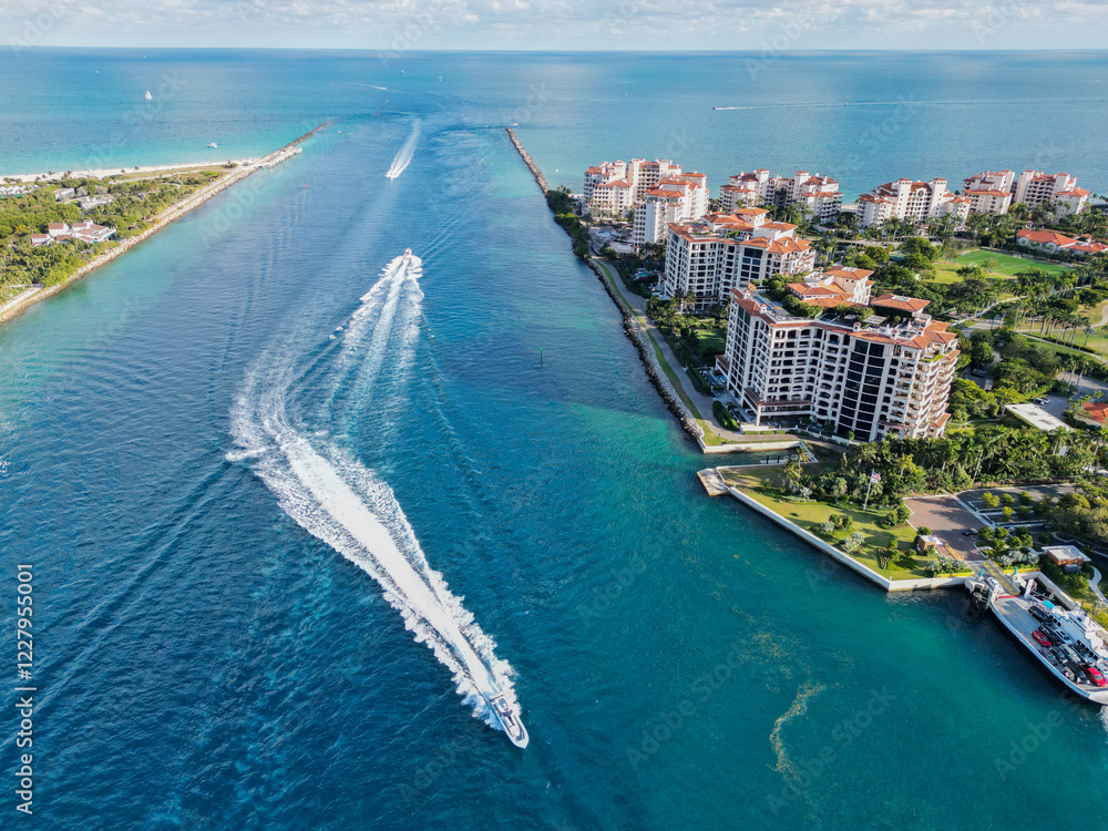 Yacht at Fisher island luxury residential building. Vacation on summer ...