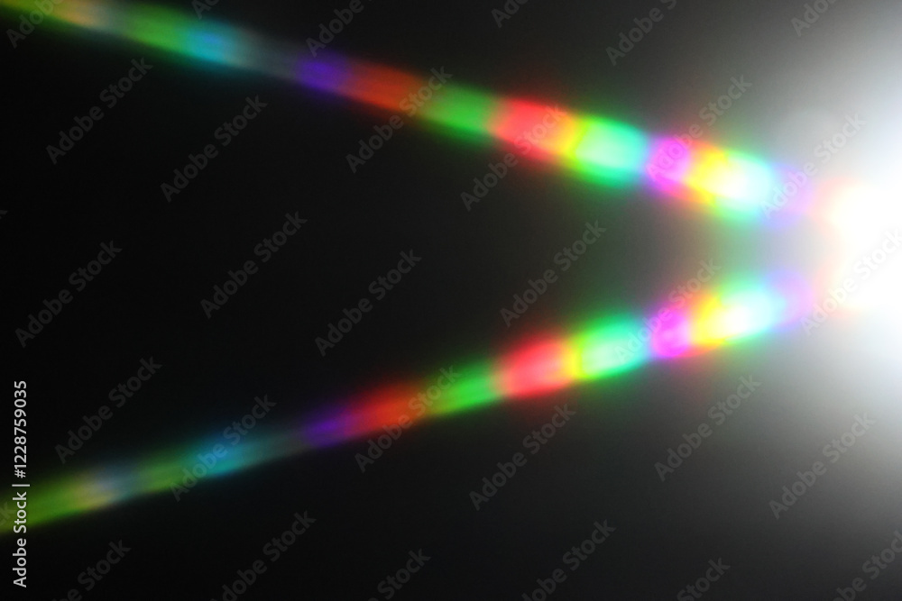 Rainbow reflective colorful sunlight on textured surface of wall ...