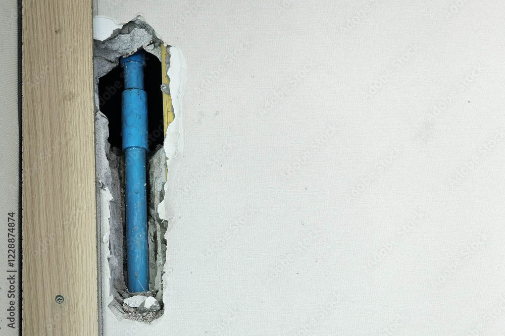 Blue PVC Water Pipe Embedded in a Concrete Wall During Construction ...