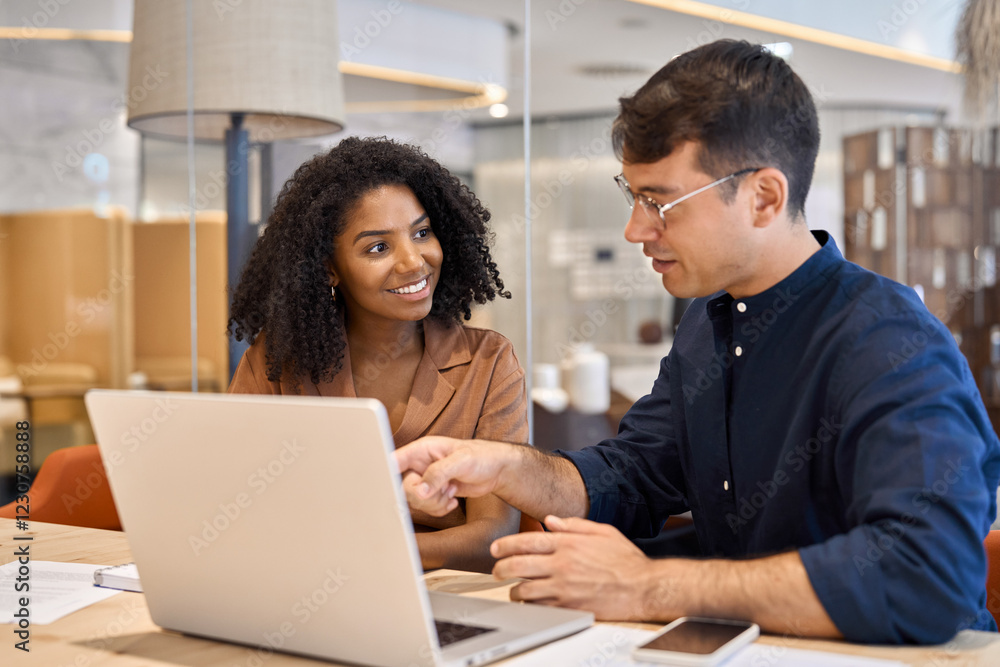 Two young busy diverse coworkers business people using laptop at office ...