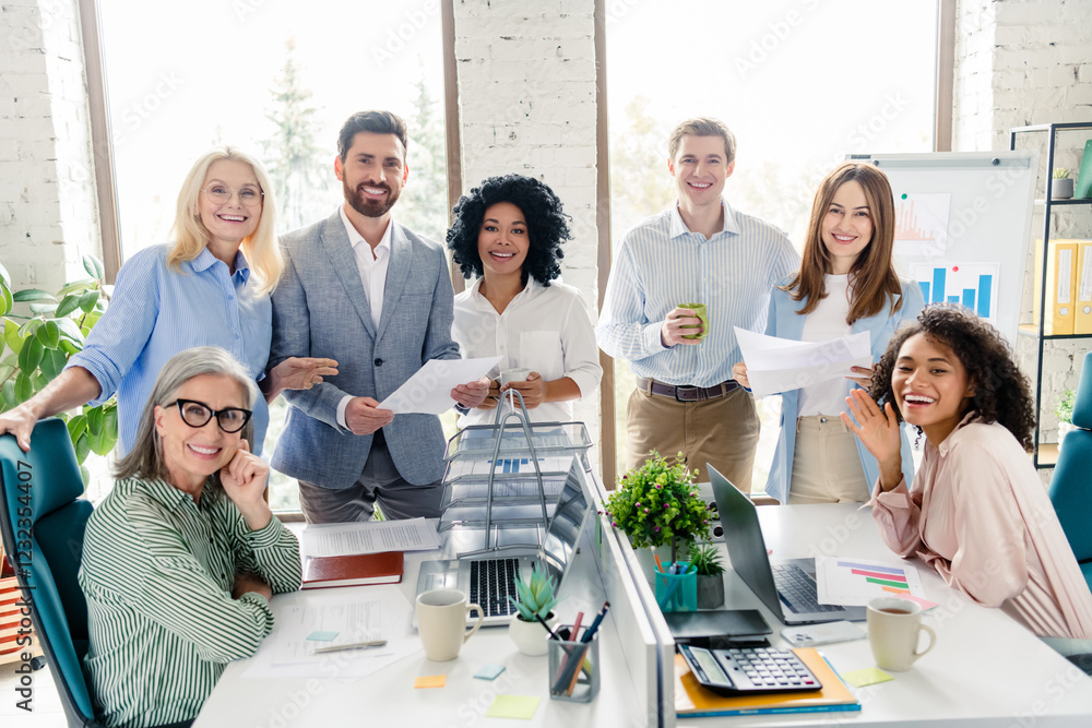 Professional team collaborating in modern office space with daylight ...