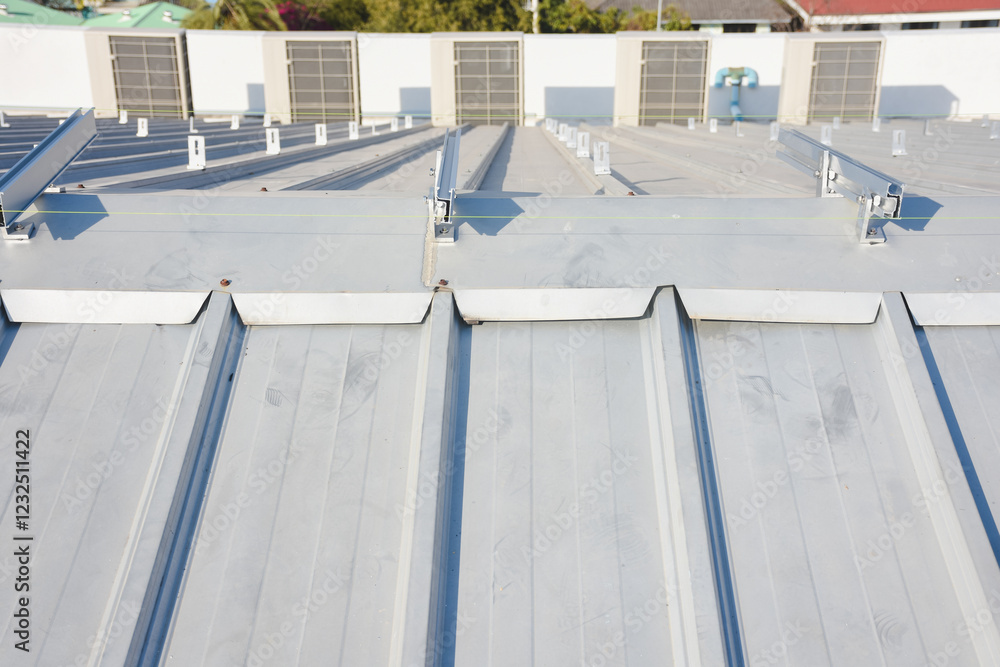 sloped metal roof. The roof has a series of parallel ridges and is ...