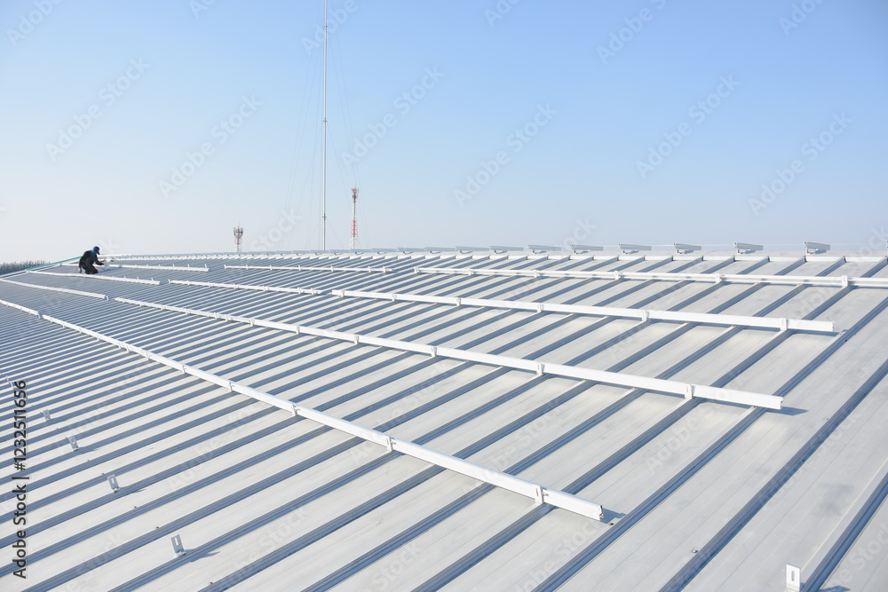 sloped metal roof. The roof has a series of parallel ridges and is ...
