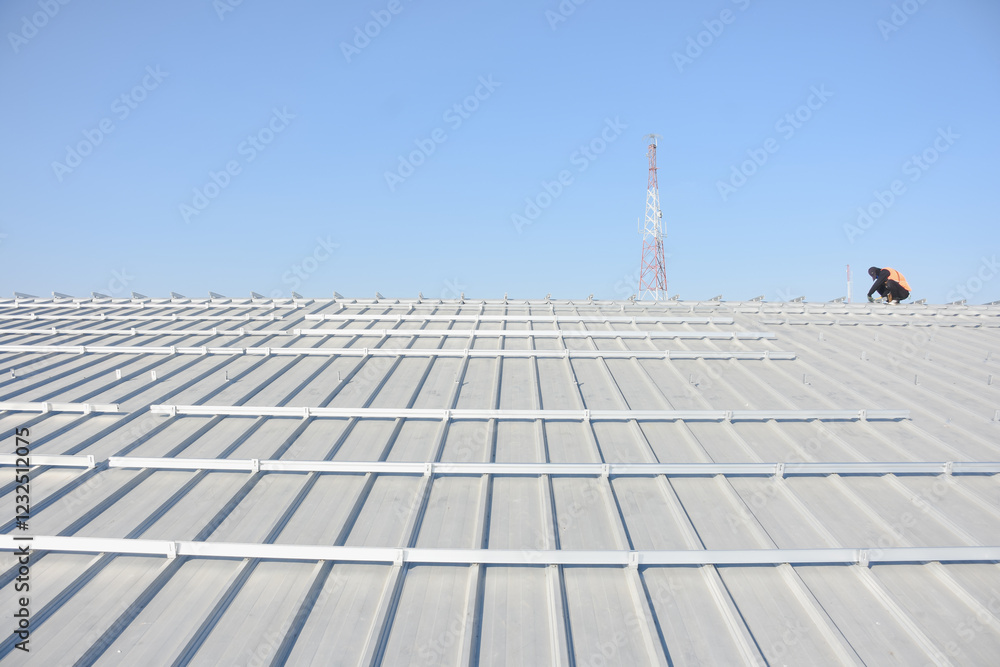sloped metal roof. The roof has a series of parallel ridges and is ...