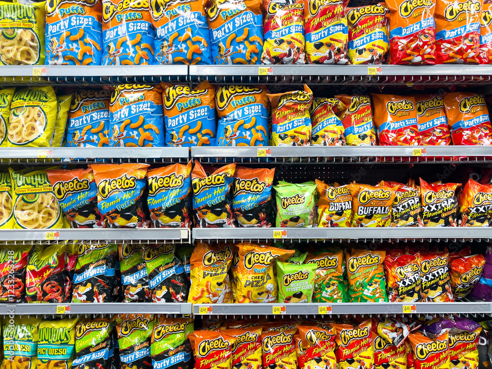 Full frame image of Cheetos brand snacks for sale at a supermarket ...