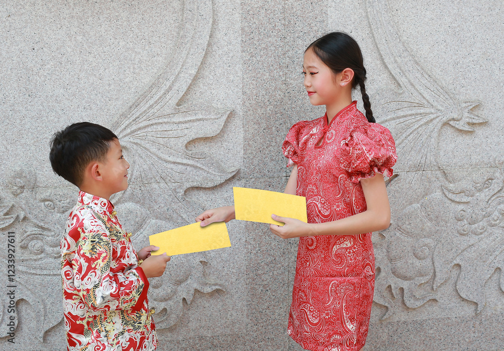 Portrait of Chinese boy and girl in traditional dress with give and ...