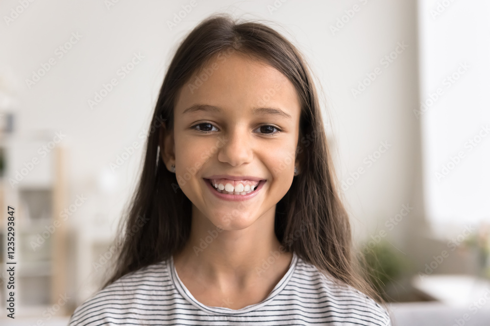 Headshot portrait smiling little girl of preteen school age look at ...