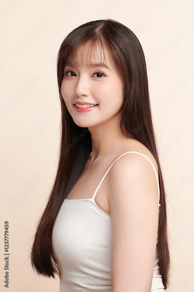 Beautiful young asian woman with clean fresh skin on beige background ...