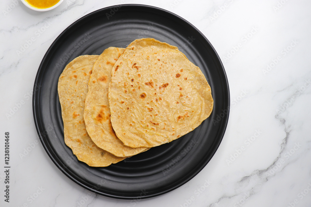 Roti and Sabzi. Indian vegetarian Thali includes bhindi fry, yellow ...