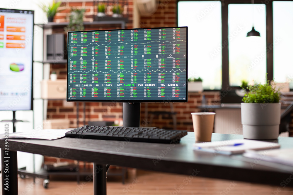 Vacant modern workspace with desktop pc displaying company statistics ...