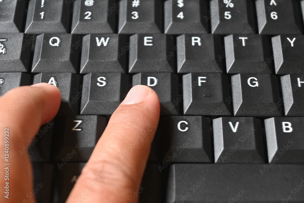 Positioning of the hand on the keyboard of a gamer. Fingers on the w,a ...