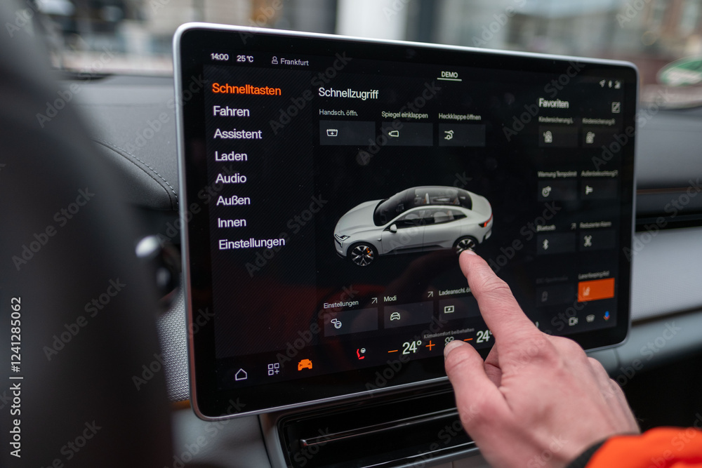 driver's hand interacts with large, intuitive touchscreen display in ...