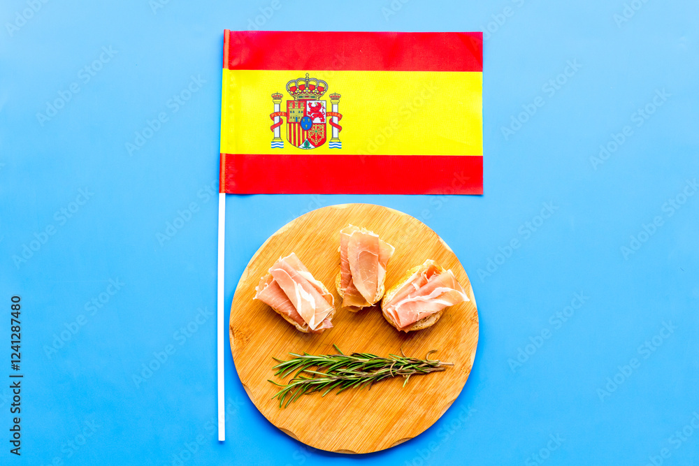 Welcome to Spain. Parma ham and Spanish flag, top view Stock Photo ...
