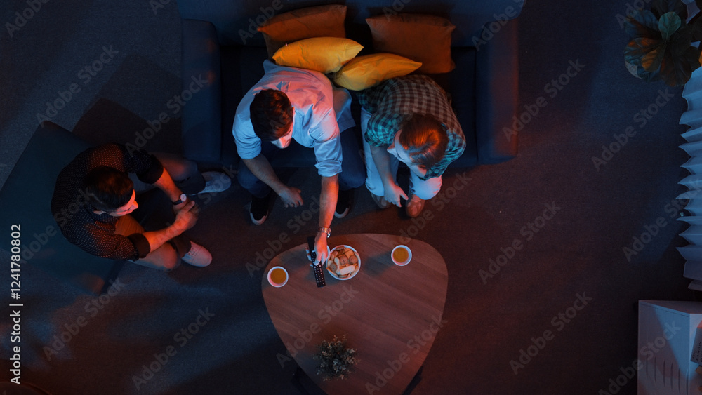 Top aerial view of caucasian father and mother watching movie while ...