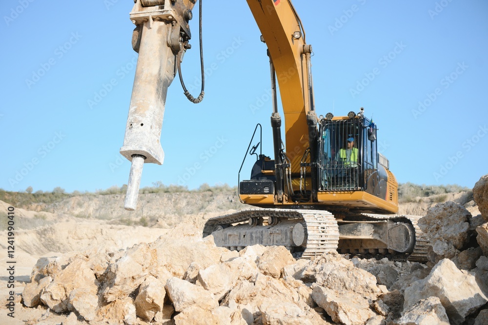 Hydraulic breaker hammer in a quarry for limestone mining with an ...