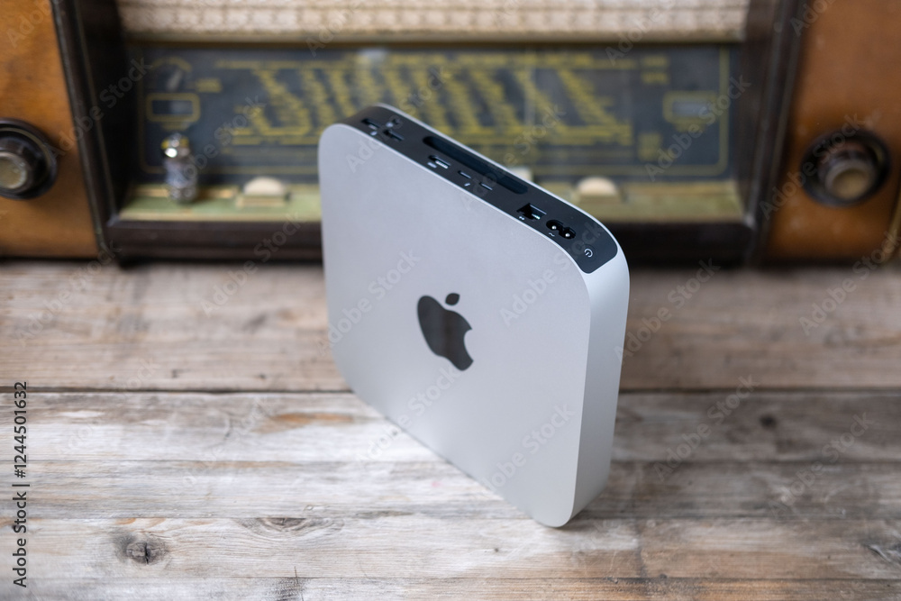 Mac Mini M1 Apple computer held, retro radio, old and new technology ...
