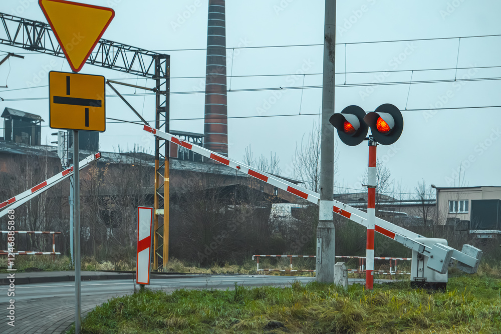 railway infrastructure ensuring safety. closing barriers and flashing ...