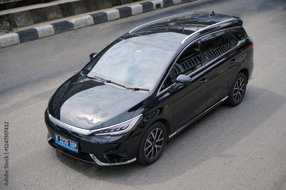 cars on the road, Electric Vehicle BYD M6 , at the Gunung Sahari Street ...