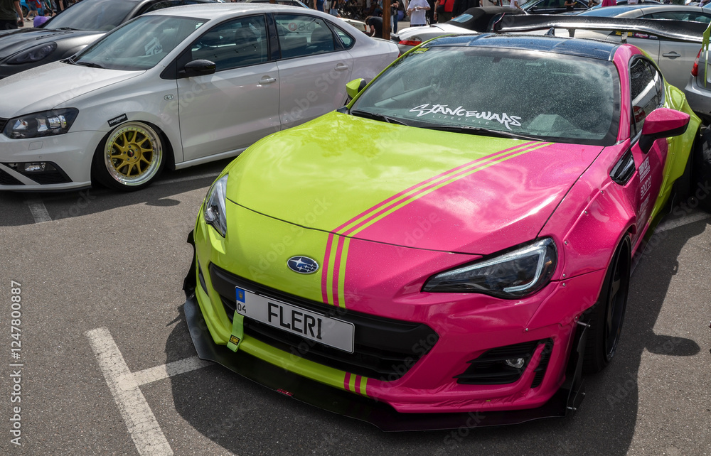 Vibrant modified Subaru BRZ painted in striking two-tone green and pink ...